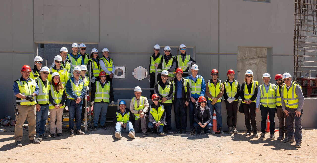 ESO Council members and ESO staff stand next to the ELT time capsule ...